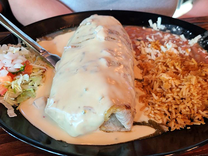 This isn't just a burrito&mdash;it's a life event draped in queso. The El Lorenzo arrives swimming in creamy sauce with rice and fresh pico standing by for support.
