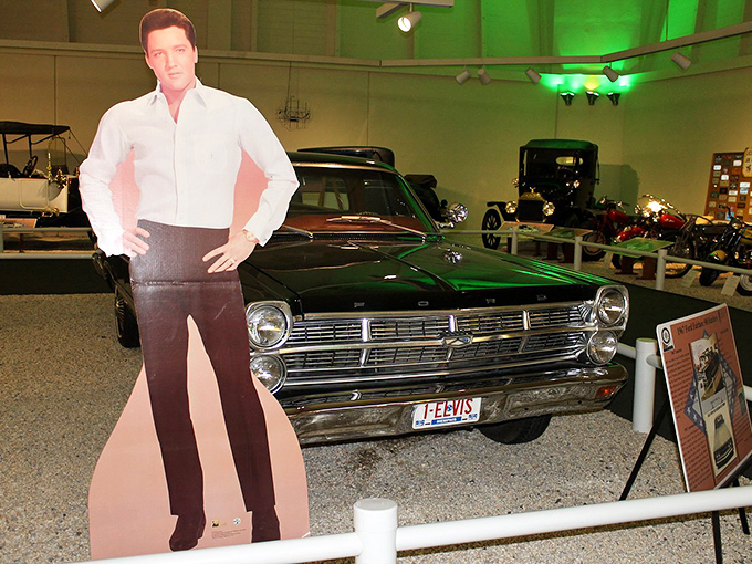 The King's ride: Elvis Presley's green chariot stands guard, a reminder that even rock royalty appreciated Detroit's rolling masterpieces.