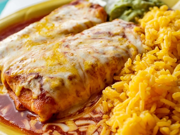 These enchiladas aren't just covered in cheese&mdash;they're embraced by it, with that perfect sauce-to-tortilla ratio that makes you want to write thank-you notes to the chef.