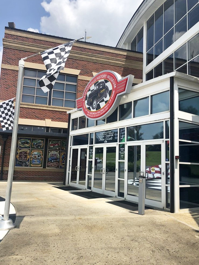 Racing's past and present merge at this entrance, where the checkered flag waves eternally. Even casual visitors feel the magnetic pull of speed culture through these doors.