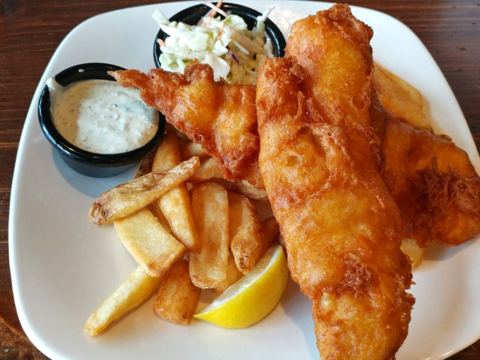 Golden-battered fish that shatters with each bite, paired with fries that could make a Frenchman weep. This isn't just dinner; it's edible joy.