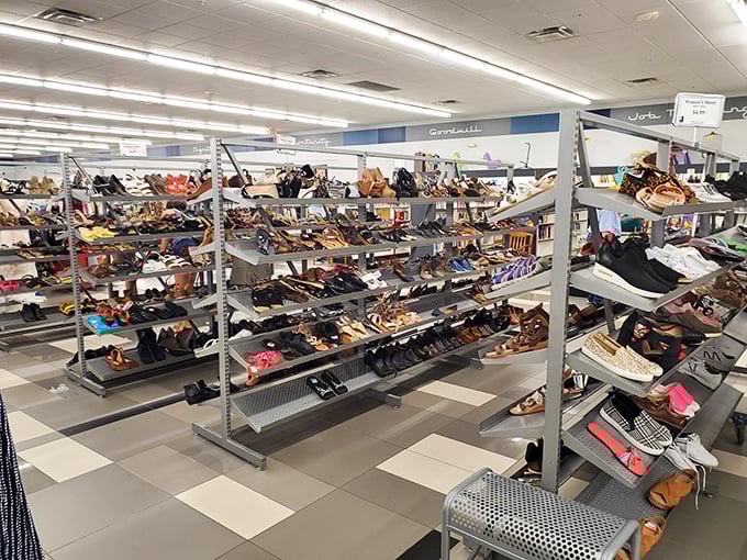Footwear fantasyland! Rows upon rows of gently-used shoes stand at attention, each pair whispering, "Take me home, I've got miles left!"