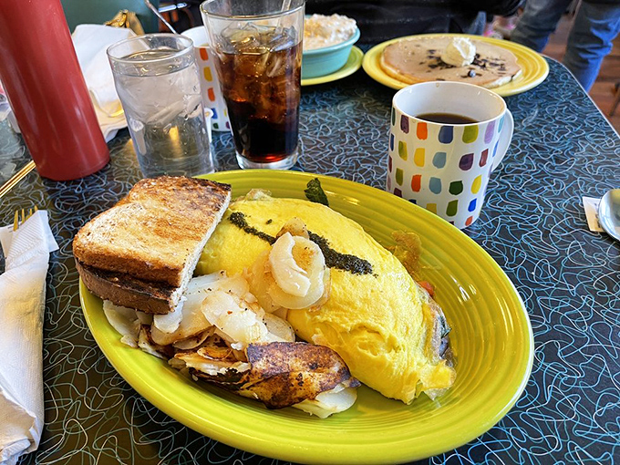 Behold the omelet that launched a thousand return visits&mdash;fluffy eggs cradling savory fillings, with perfectly golden toast standing by for dipping duty.