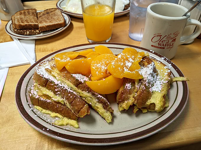 French toast that makes you question why anyone would ever skip breakfast. Those peaches aren't just toppings&mdash;they're crown jewels.