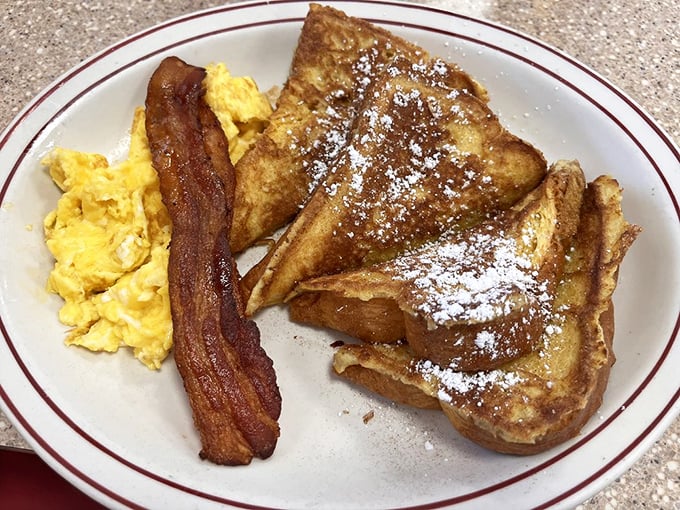 French toast that's achieved that mythical balance&mdash;crispy edges, custardy center, and enough powdered sugar to make your dentist wince.