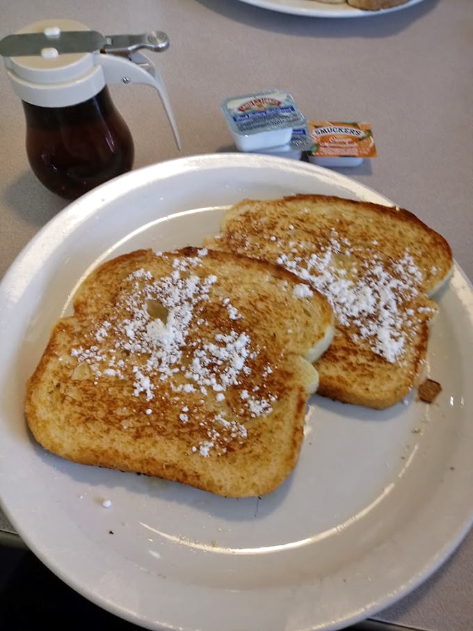 French toast wearing powdered sugar like a winter coat. Simple pleasures that make you wonder why brunch ever needed to get complicated.