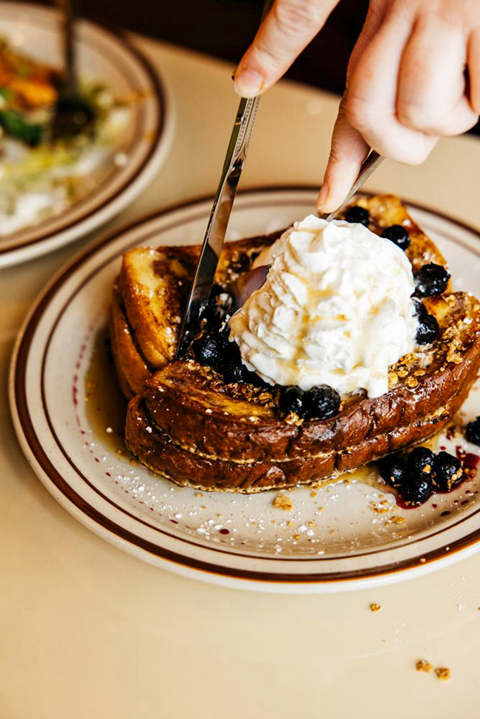 French toast that makes you question all other breakfasts. Those blueberries and whipped cream aren't toppings&mdash;they're a crown fit for breakfast royalty.
