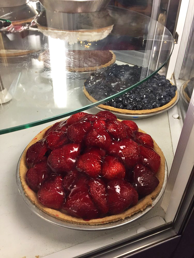 Behold the star of the show—a strawberry pie that makes you involuntarily close your eyes with the first bite. This isn't dessert; it's therapy.