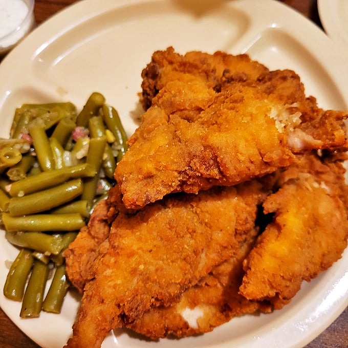 Golden-brown perfection that makes you question every other fried chicken you've eaten. That crackling crust protecting juicy meat is what food dreams are made of.