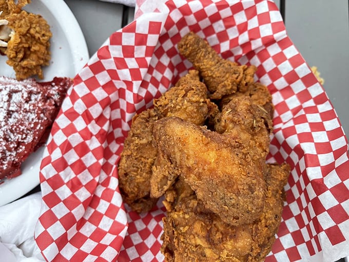 Golden-brown perfection nestled in checkered paper. This chicken didn't just get fried&mdash;it got promoted to the culinary hall of fame.