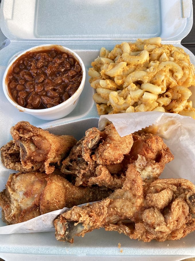Fried chicken so perfectly golden it deserves its own trophy, alongside mac and cheese that's clearly been taking its vitamins.