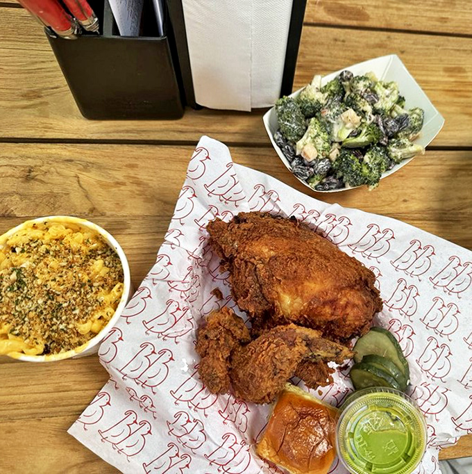 The holy trinity of comfort: golden-fried chicken, creamy mac and cheese, and broccoli salad that makes eating vegetables feel like cheating at life.