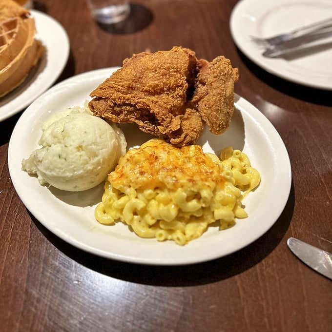 This is what food dreams are made of &ndash; golden fried chicken with a perfect crackling crust alongside creamy mac and cheese that belongs in the Comfort Food Hall of Fame.
