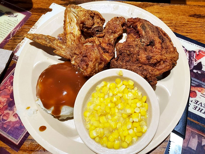 Golden-brown fried chicken that shatters with each bite, alongside creamy mashed potatoes and sweet corn&mdash;a holy trinity of comfort food done right.