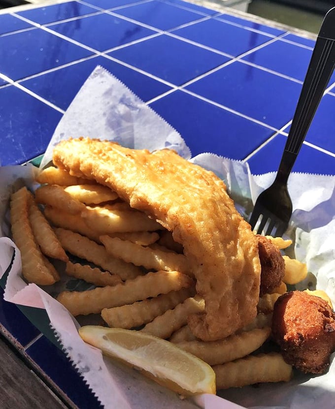 Golden-battered cod that shatters like glass when your fork hits it. The kind of fried fish that makes you question all others.