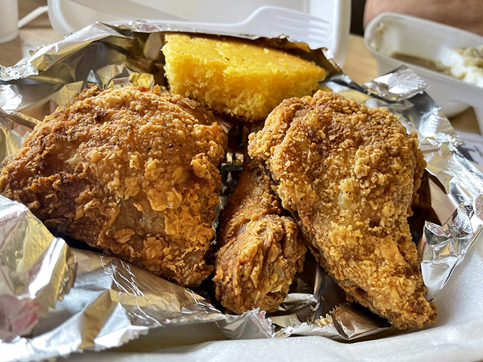 Golden-brown perfection doesn't happen by accident. This fried chicken's crackling crust guards juicy meat beneath like Fort Knox protects gold.