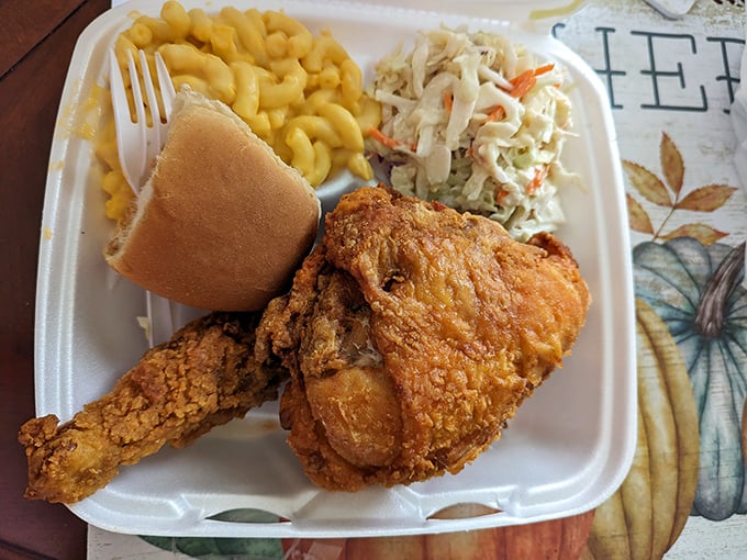 Golden-brown perfection meets creamy mac and cheese. This isn't just lunch; it's a Southern symphony on a styrofoam stage.