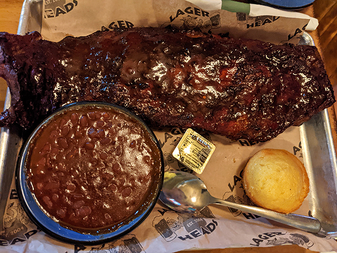 Behold the holy grail of barbecue&mdash;a full rack of ribs with that glistening bark, a side of beans, and cornbread that's not playing second fiddle.
