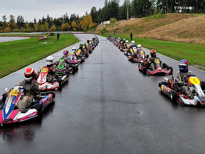 Starting grid perfection: racers lined up like colorful candies in a box, each helmet hiding the same mix of nervousness and unbridled excitement.