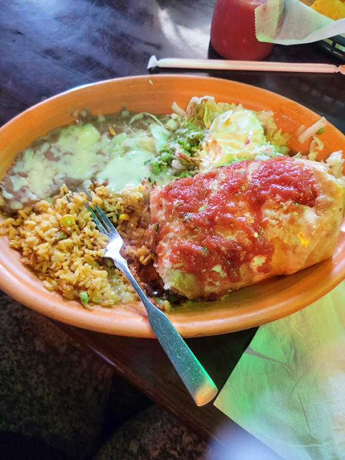 Generous portions that spill over the edges of vibrant plates. The sauce-to-cheese ratio here deserves a mathematical study.