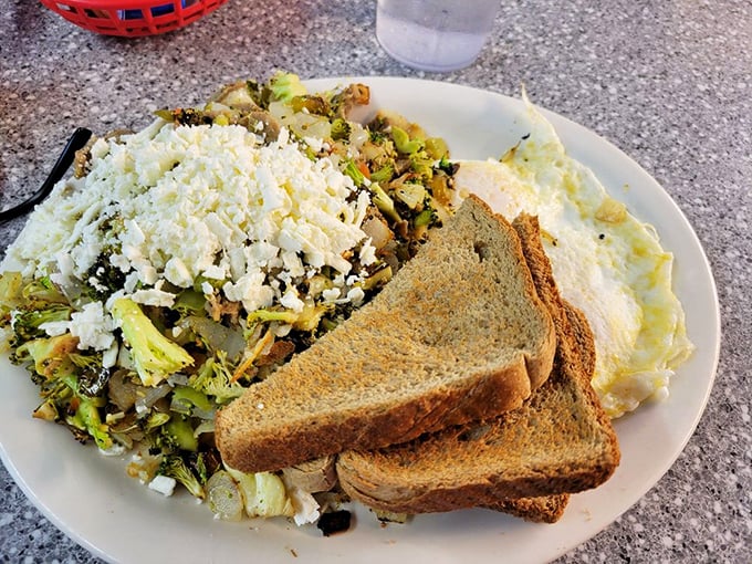 Behold the Gyro Hippie Hash in its natural habitat&mdash;crispy potatoes beneath vegetables and feta, with eggs and toast standing guard.