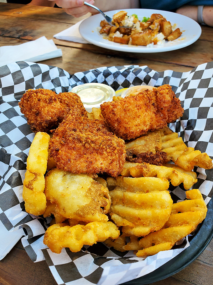 Golden-battered halibut resting on a bed of crispy fries &ndash; the kind of simple perfection that makes you wonder why you'd ever eat anything else.