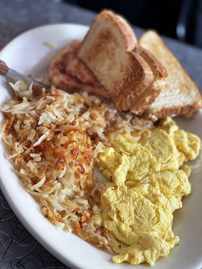 Breakfast perfection doesn't need fancy words. Golden hash browns with the ideal crisp-to-tender ratio, fluffy eggs, and toast that actually deserves to be called toast.