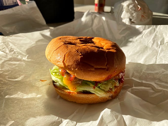 The Hickory Burger arrives like a humble masterpiece&mdash;melted cheese cascading over the patty, crisp lettuce peeking out, all nestled in a perfectly toasted bun.