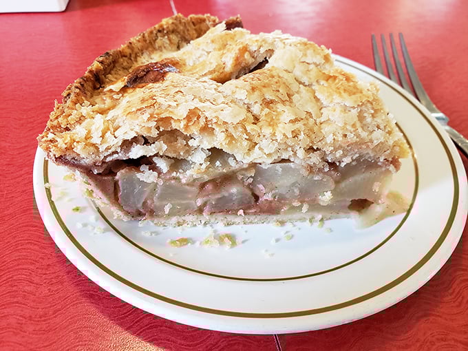 That perfect moment when fork meets apple pie&mdash;the crust shatters just so, revealing tender fruit beneath in a dance as old as America itself.