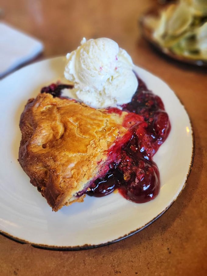 The legendary olallieberry pie arrives like a celebrity&mdash;golden crust, ruby filling, and a scoop of vanilla ice cream playing the perfect supporting role.
