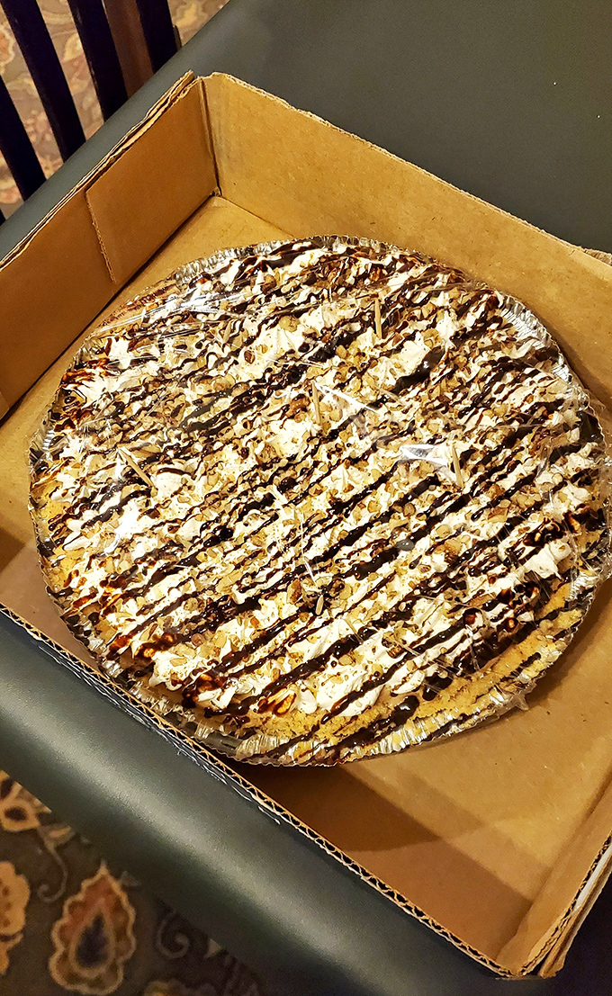 This isn't just pie&mdash;it's a masterclass in dessert architecture. Layers of cream cheese, chocolate, and whipped topping drizzled with pure joy.