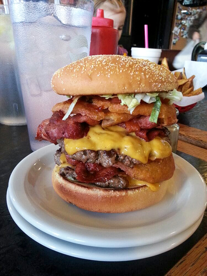 Not so much a burger as a skyscraper of beef, cheese, and toppings that requires a game plan before the first bite.
