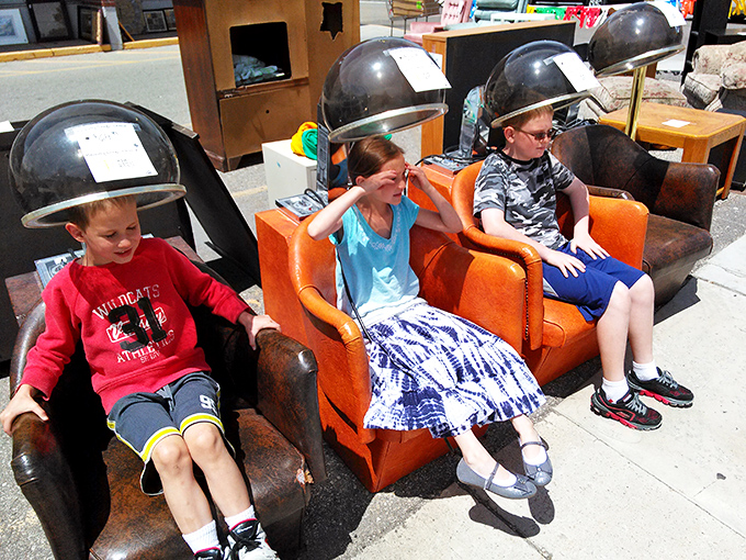 Young thrifters test out vintage salon chairs&mdash;proving that shopping secondhand is an adventure for all generations.