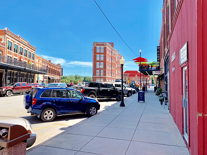 Sunlight bathes the wide sidewalks of downtown, where colorful umbrellas invite you to linger longer than you planned.