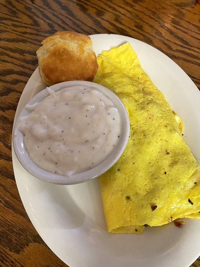 Sunshine on a plate! This golden omelet with country gravy and a biscuit is Tennessee's answer to "What's happiness look like?"