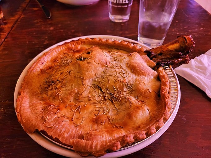 That's not just a pot pie&mdash;it's edible architecture with a bone handle poking through like nature's own "dig here" sign.