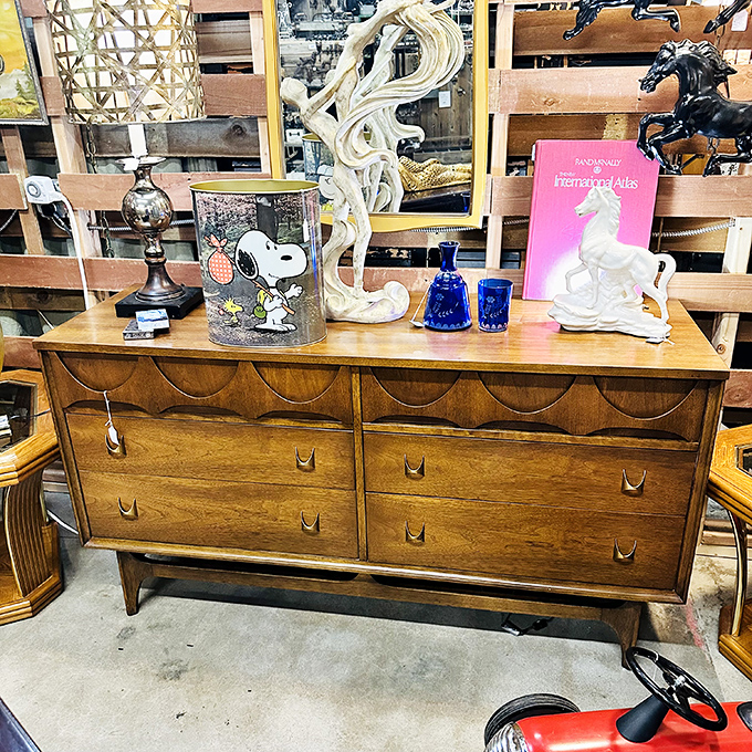 Mid-century craftsmanship meets pop culture with that Snoopy glass&mdash;the kind of dresser that makes modern furniture seem like it's made from cardboard and prayers.