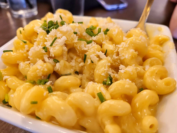 Mac and cheese shouldn't make you emotional, yet here I am, getting misty-eyed over this golden masterpiece. The chives aren't garnish—they're confetti celebrating cheese perfection.