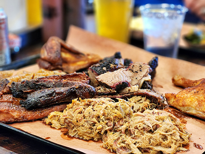 Barbecue plated as nature intended: on butcher paper with zero pretension. That bark on the brisket is the result of patience, not shortcuts.