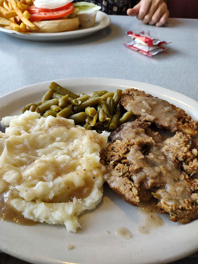 Meatloaf that would make your grandmother both jealous and proud. Those mashed potatoes aren't just a side dish&mdash;they're a fluffy, buttery life raft in a sea of gravy.