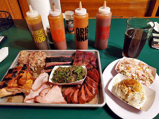 Behold, the BBQ motherload! This platter is what meat lovers dream about – a symphony of flavors that would make even Ron Swanson weak in the knees.