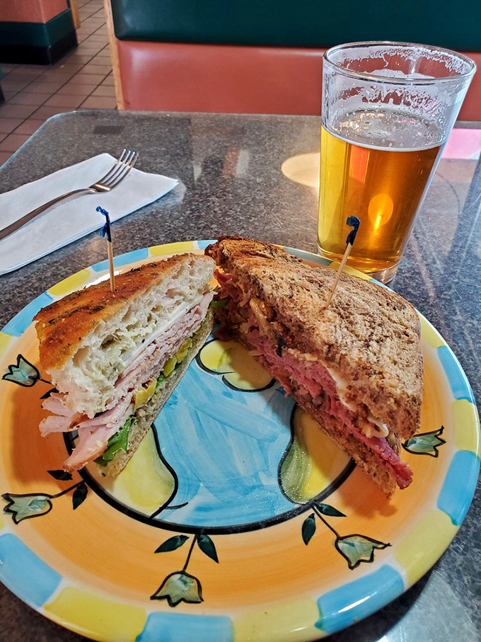 Behold sandwich architecture at its finest: layers of pink meat, melted cheese, and golden bread that would make Frank Lloyd Wright jealous.