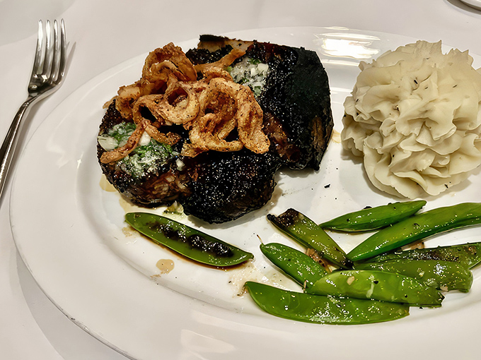When a steak arrives wearing a crown of melting butter and crisp onion straws, you don't ask questions&mdash;you simply give thanks and unsheathe your knife.