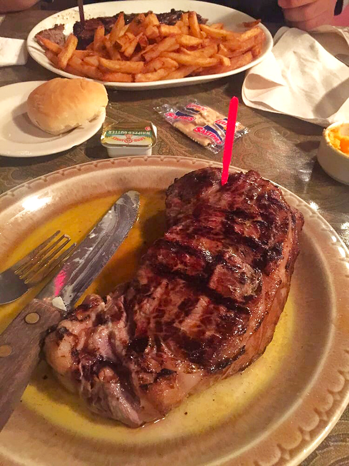 This New York Strip isn't just a steak; it's a masterpiece of char and juiciness that makes vegetarians question their life choices.
