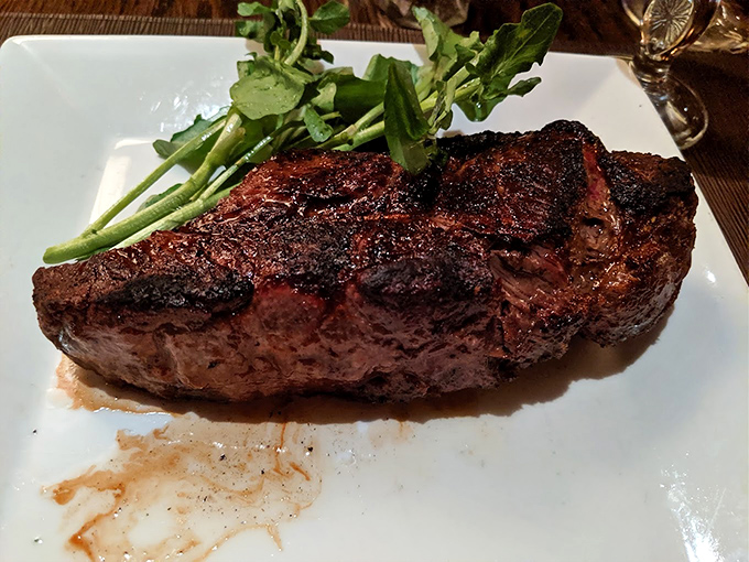 The New York Strip, perfectly seared with just the right amount of char. If Michelangelo sculpted steak instead of marble, it would look like this.