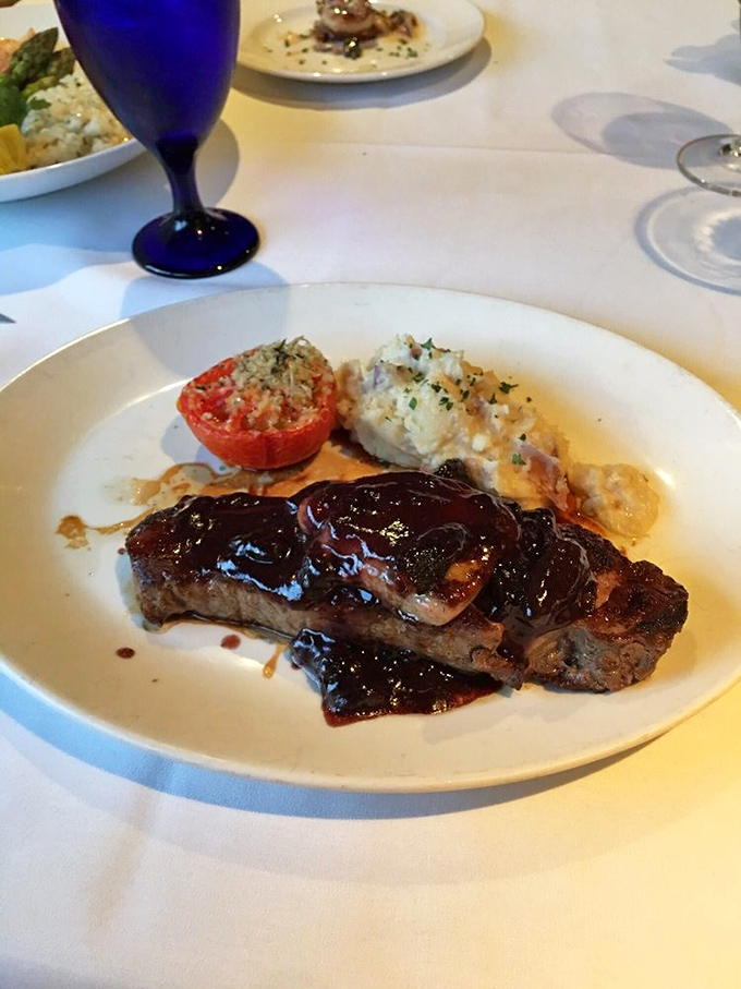 That glossy sauce cascading over perfectly seared beef isn't just a topping &ndash; it's a life-affirming declaration that some things in this world are still unquestionably right.