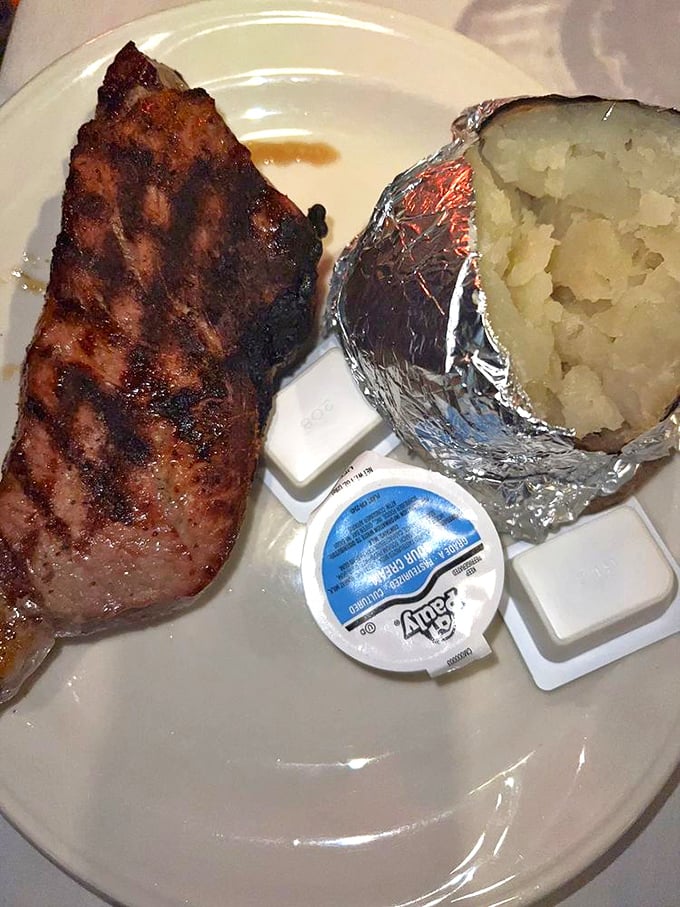 Simplicity at its finest: a New York Strip with the perfect char, a foil-wrapped potato, and zero pretension. Some relationships should be this straightforward.