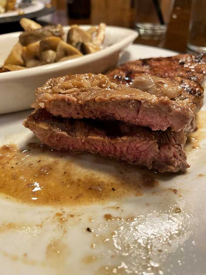 This New York Strip isn't just cooked&mdash;it's been coaxed to perfection. The kind of steak that makes conversation stop mid-sentence.