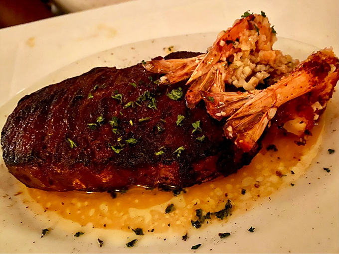 Surf meets turf in perfect harmony. That steak isn't just cooked&mdash;it's been sweet-talked to perfection while those shrimp look ready for their close-up.