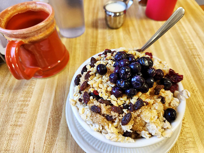 Oatmeal reimagined as a breakfast masterpiece, where blueberries and crumble toppings transform the humble grain into something worth waking up for.